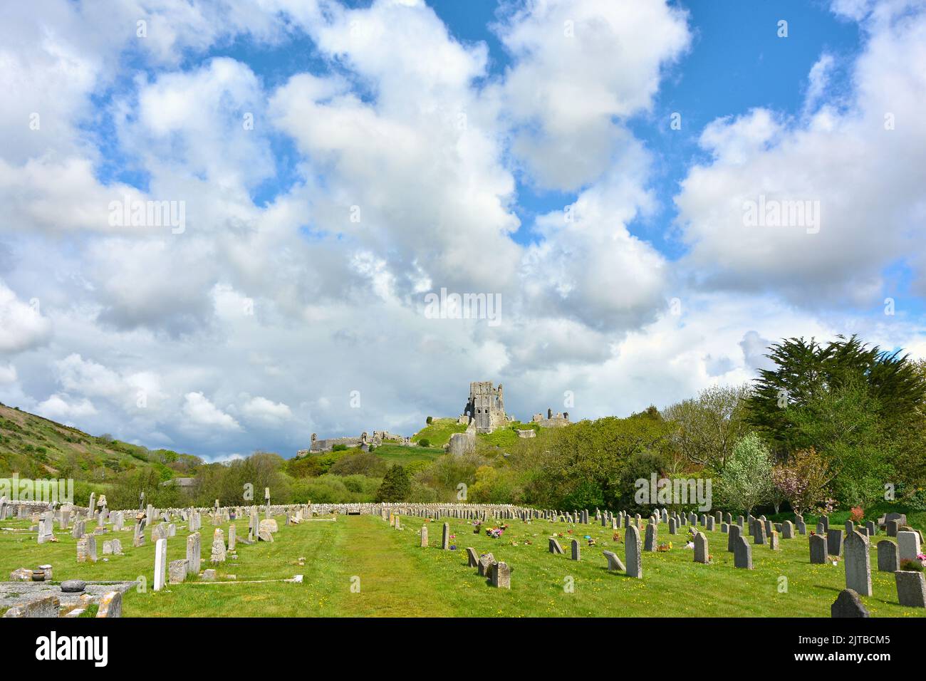 Cemetery with Corfe Castle in the background, Jurassic Coast, UK Stock ...