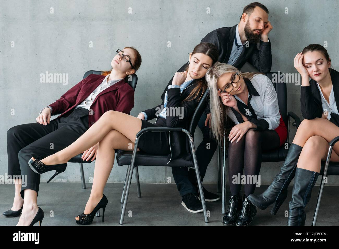 corporate workaholic overworking team sleep chair Stock Photo - Alamy