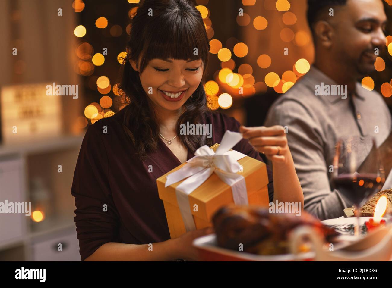 Beautiful female opening gift hi-res stock photography and images - Alamy