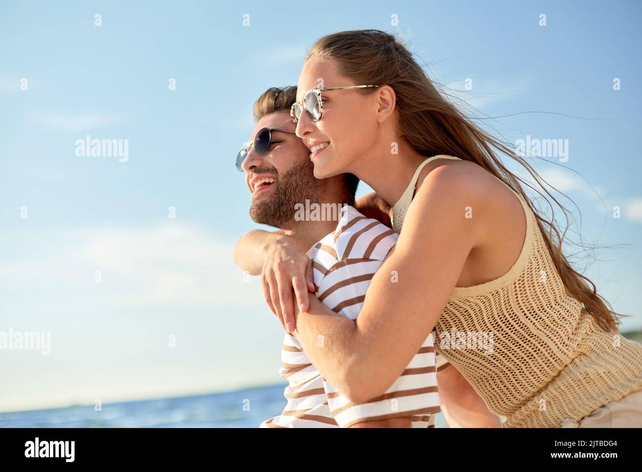happy couple hugging on summer beach Stock Photo - Alamy