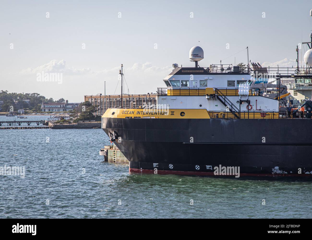 A closeup of a big ocean research ship sits in Woods Hole on cape cod ...