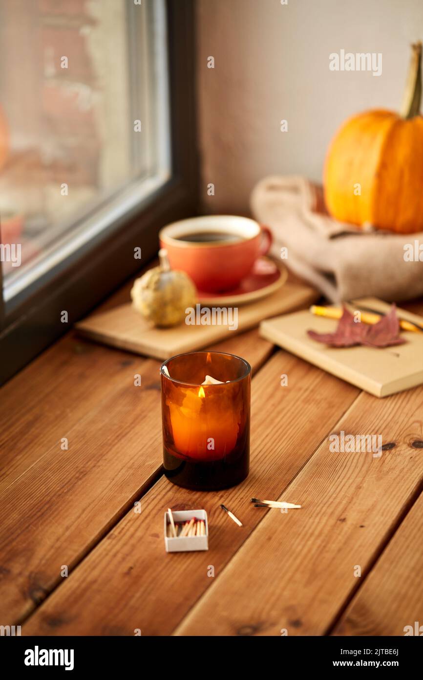 candle and matches on window sill in autumn Stock Photo - Alamy