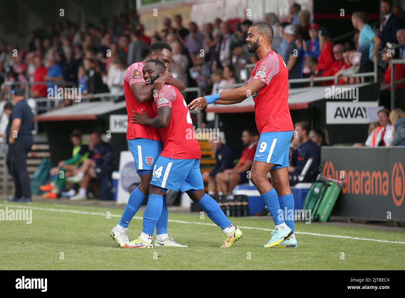 Junior Morias of Dagenham scores the fourth goal for his team and ...