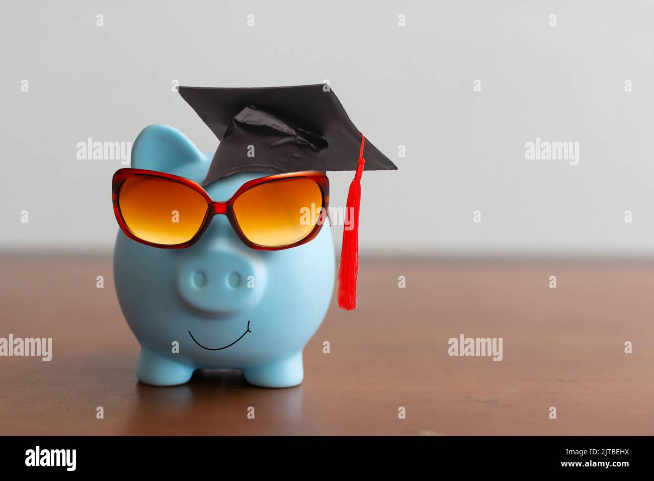 College graduate student diploma piggy bank Stock Photo - Alamy