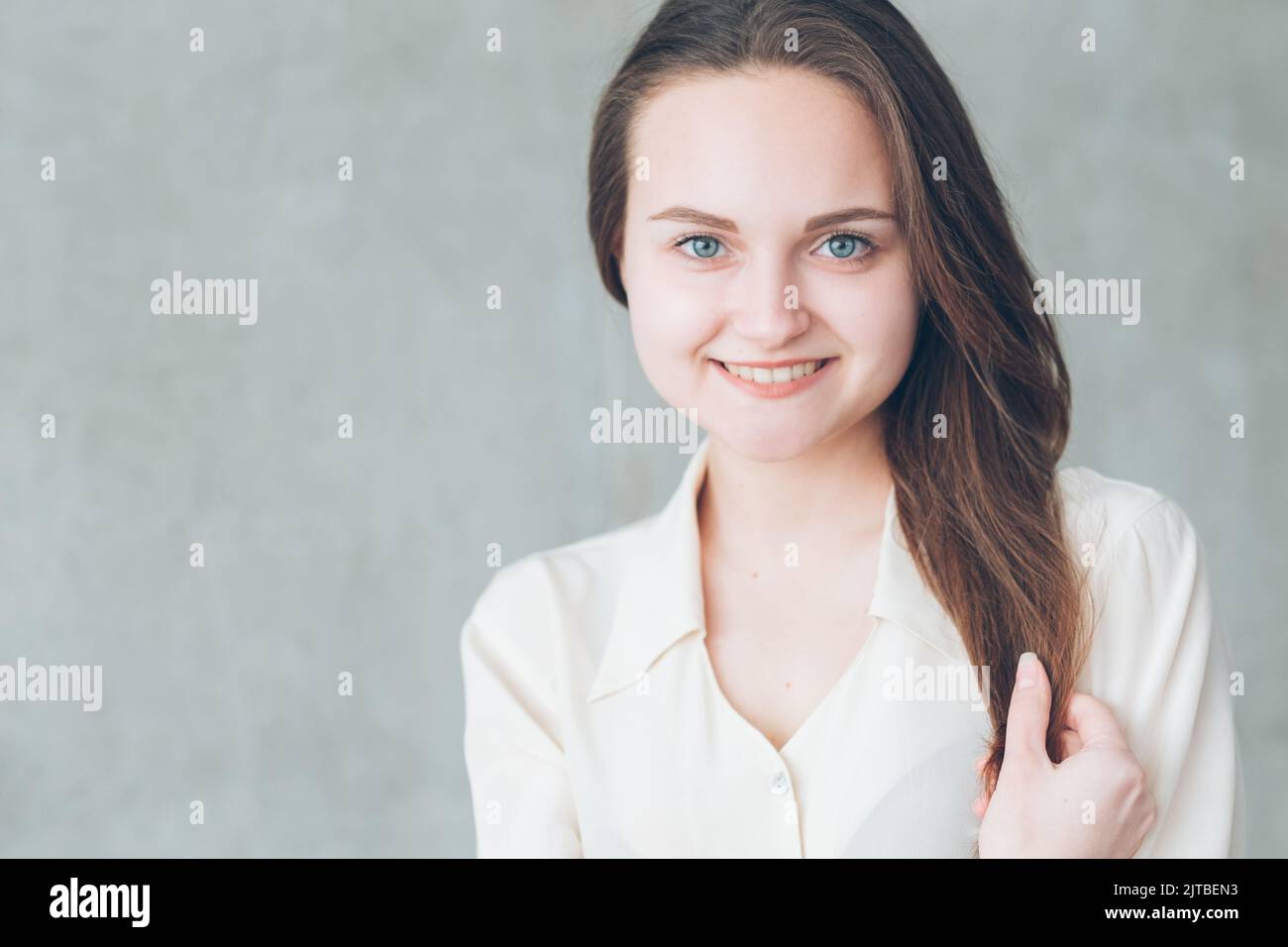 smiling young woman portrait hair care hairstyle Stock Photo - Alamy