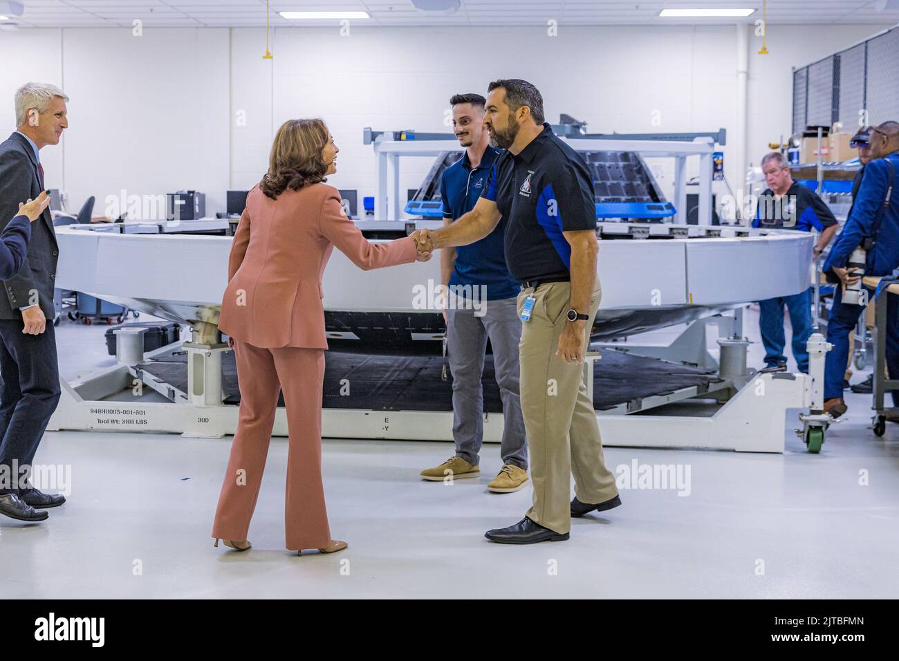 Vice President Kamala Harris is greeted by NASA representatives during ...