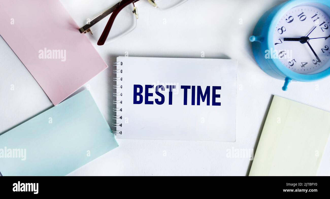 The inscription BEST TIME on a notebook, watches, stickers and glasses ...