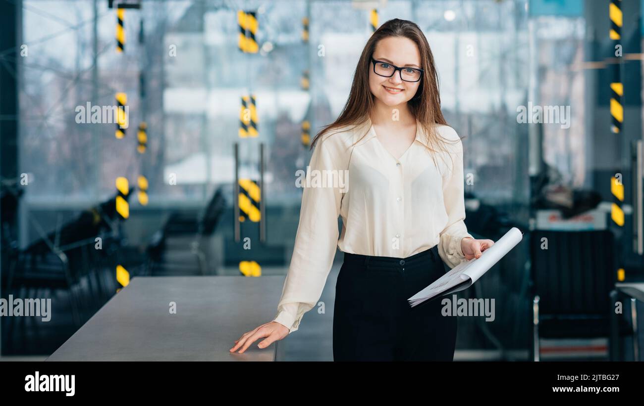 smiling employee intern workplace hold documents Stock Photo - Alamy