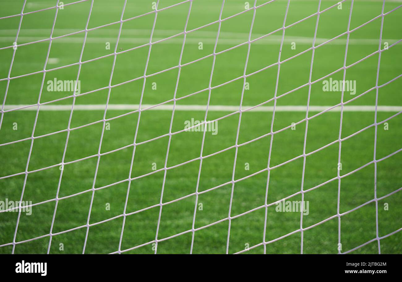 Behind goal of soccer field. Soccer net background. Soccer, football ...