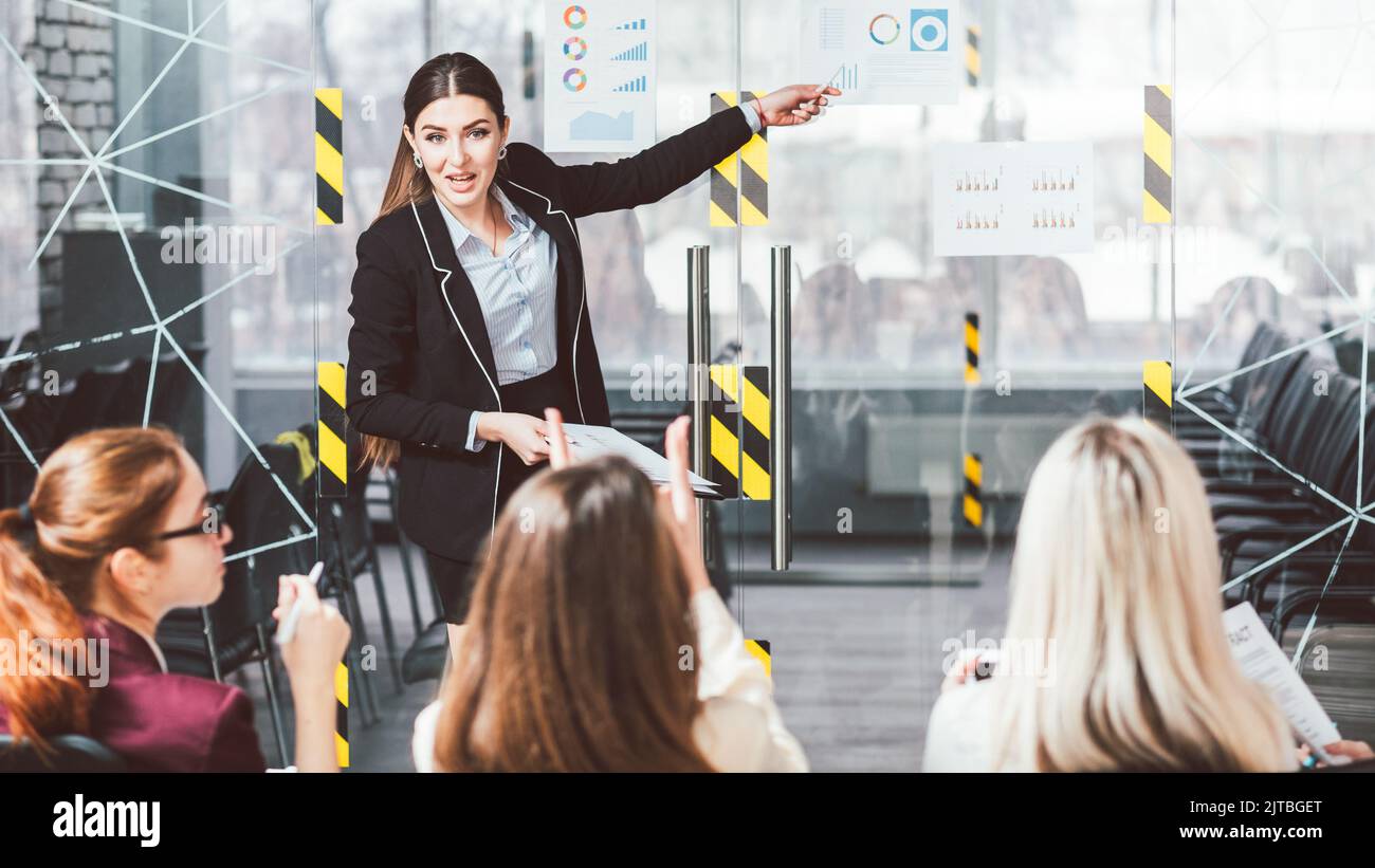women business training female coach speaker Stock Photo - Alamy