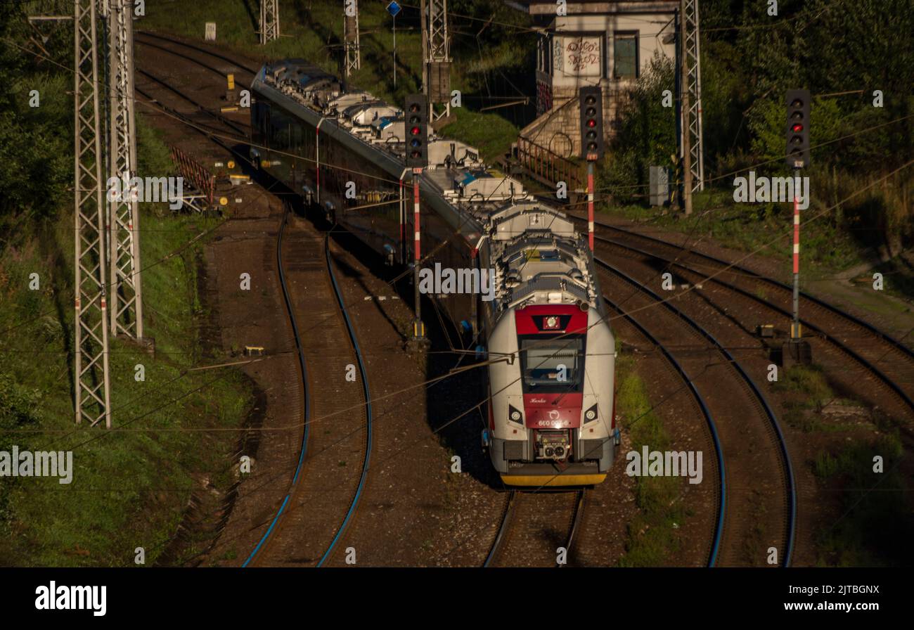 Passenger electric train coming to station Strba in Slovakia montains ...