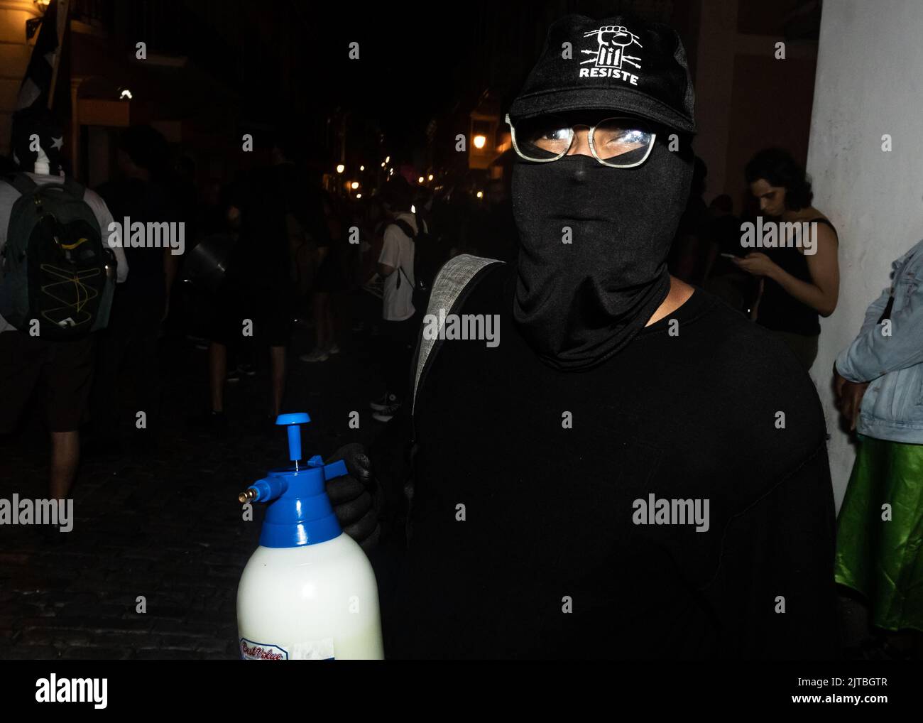 A LUMA Energy protester with soap and water eyewash, anticipating OC ...