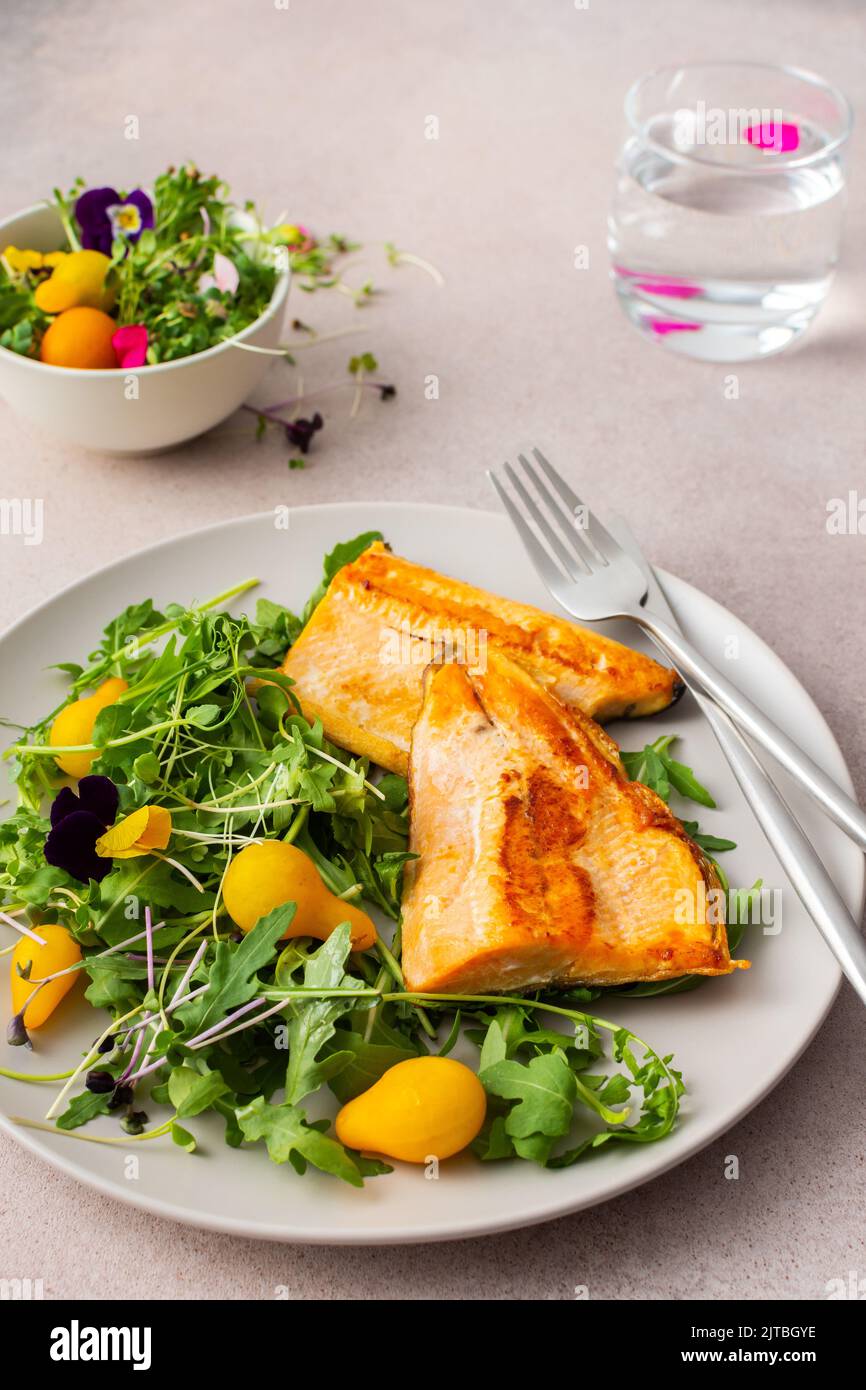 Delicious lunch with salad and fried char, healthy red fish and ...