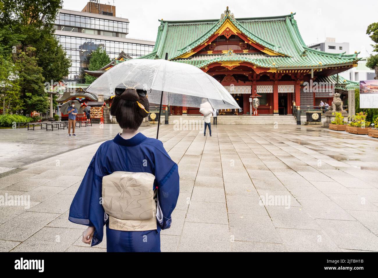 A Japanese geisha wearing a traditional kimono, walks around the Kanda ...
