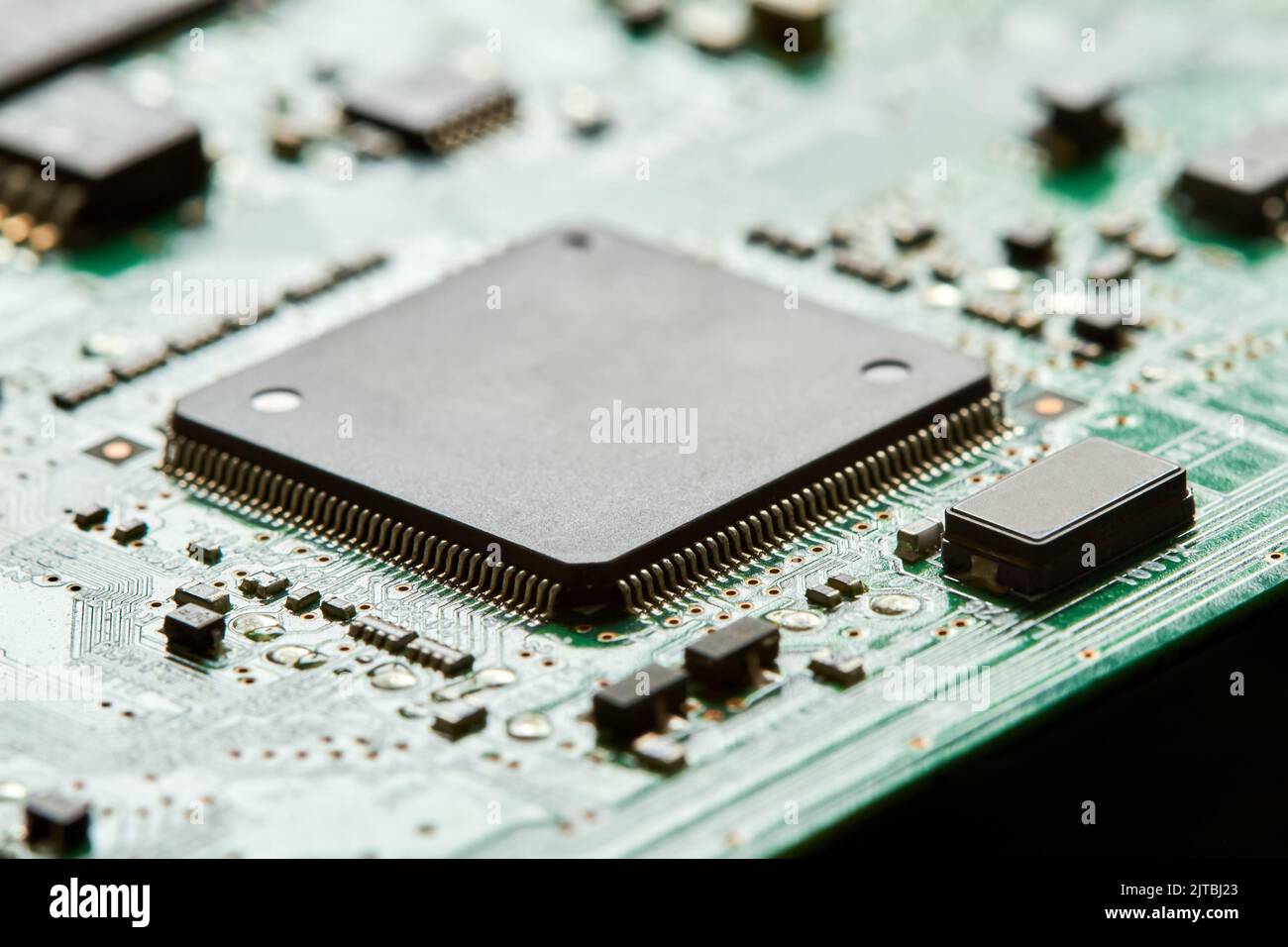 Close-up of computer chip on a part of electronic printed circuit board ...