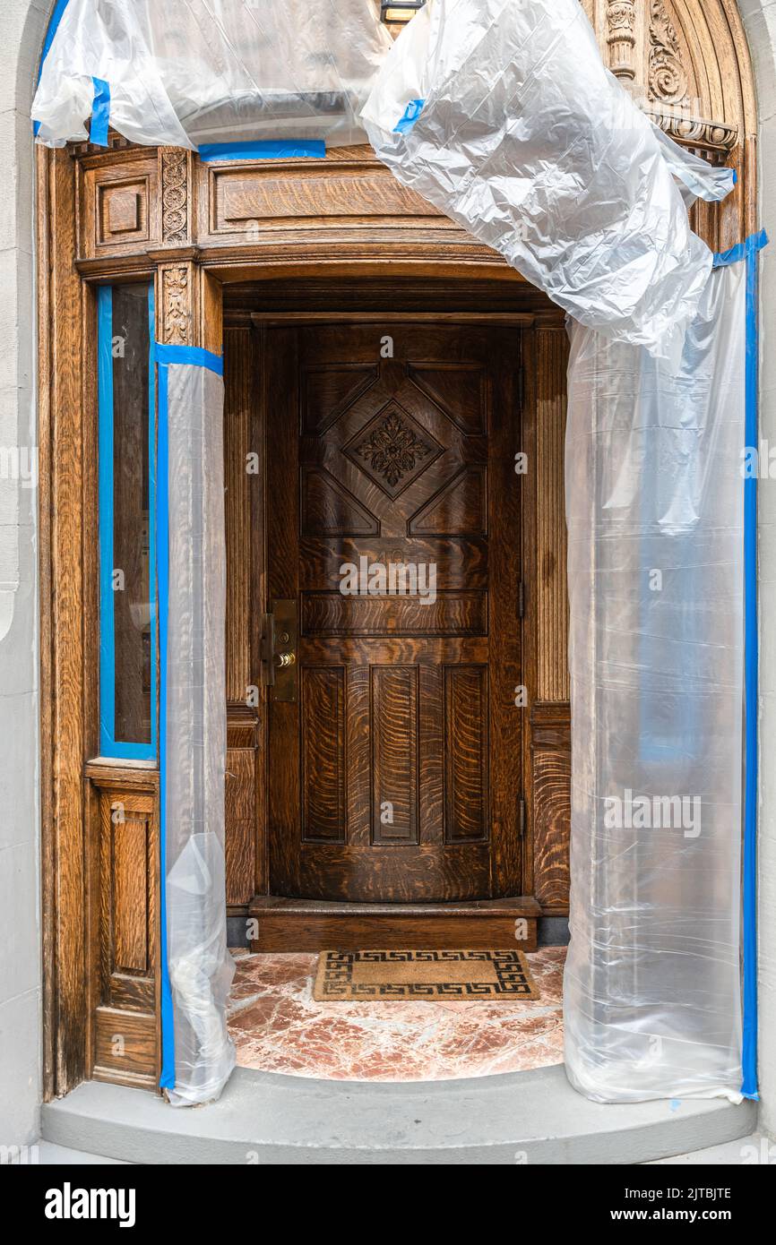 An old door of building under renovation with protective covering Stock ...