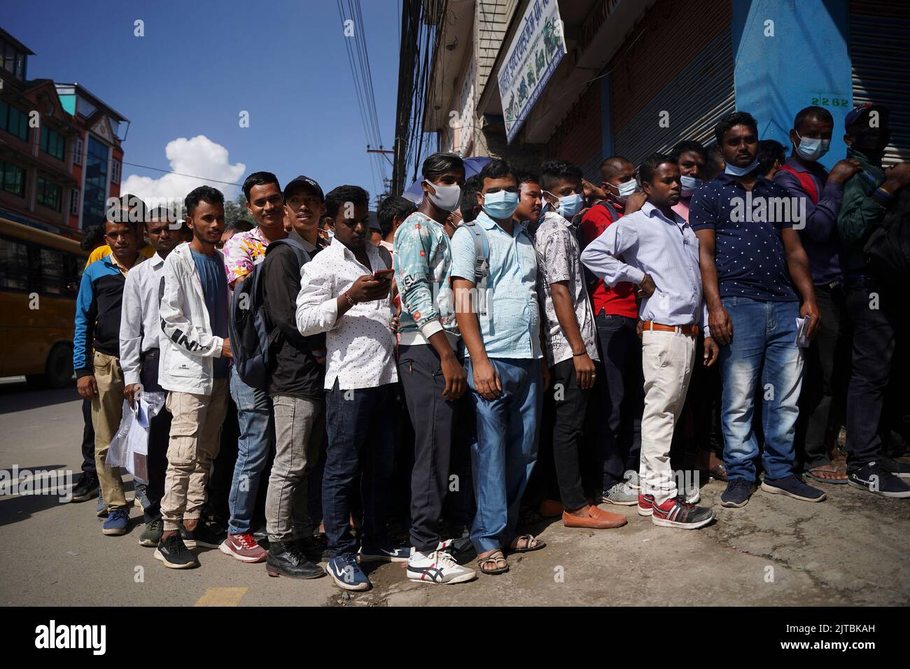 Kathmandu, Nepal. 29th Aug, 2022. Nepali youth stand in a queue to wait ...