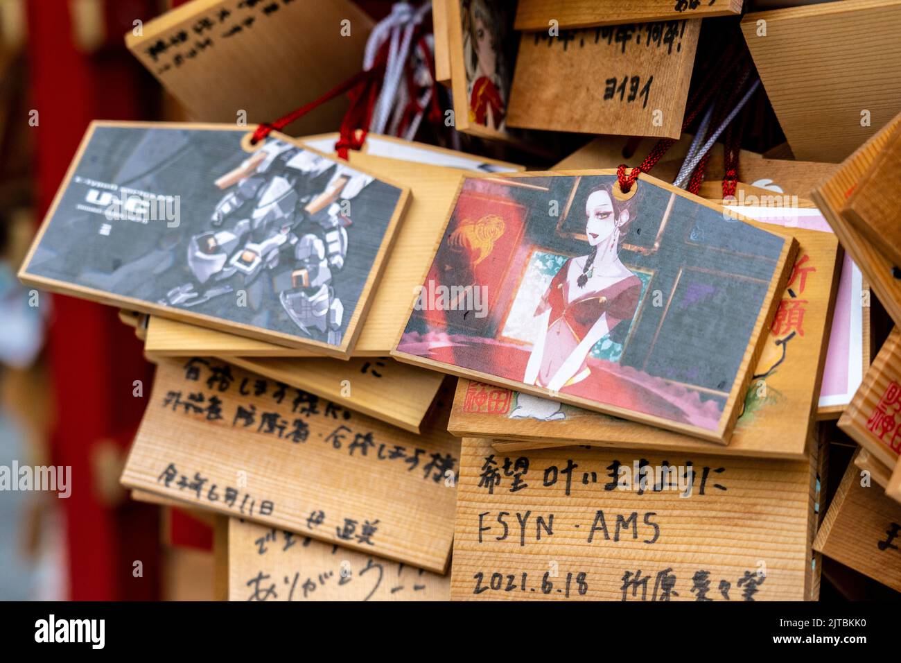 Japanese anime and manga characters painted on ema prayer plaques at ...