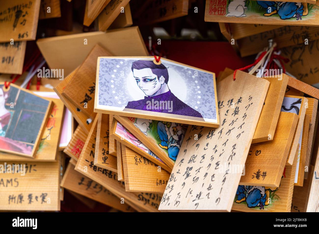 Japanese anime and manga characters painted on ema prayer plaques at ...