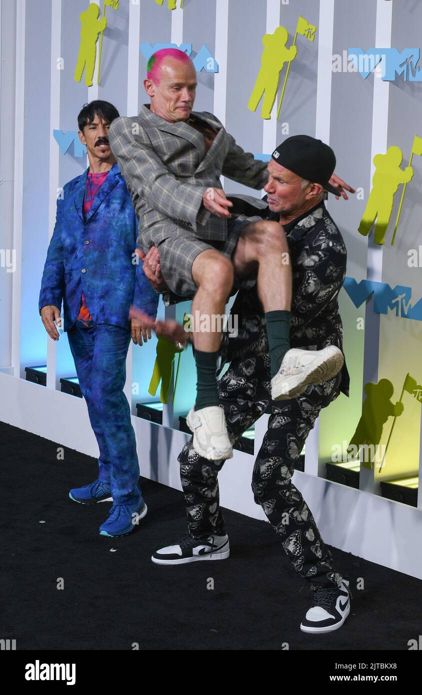 Anthony Kiedis, Flea and Chad Smith of Red Hot Chili Peppers attend the ...