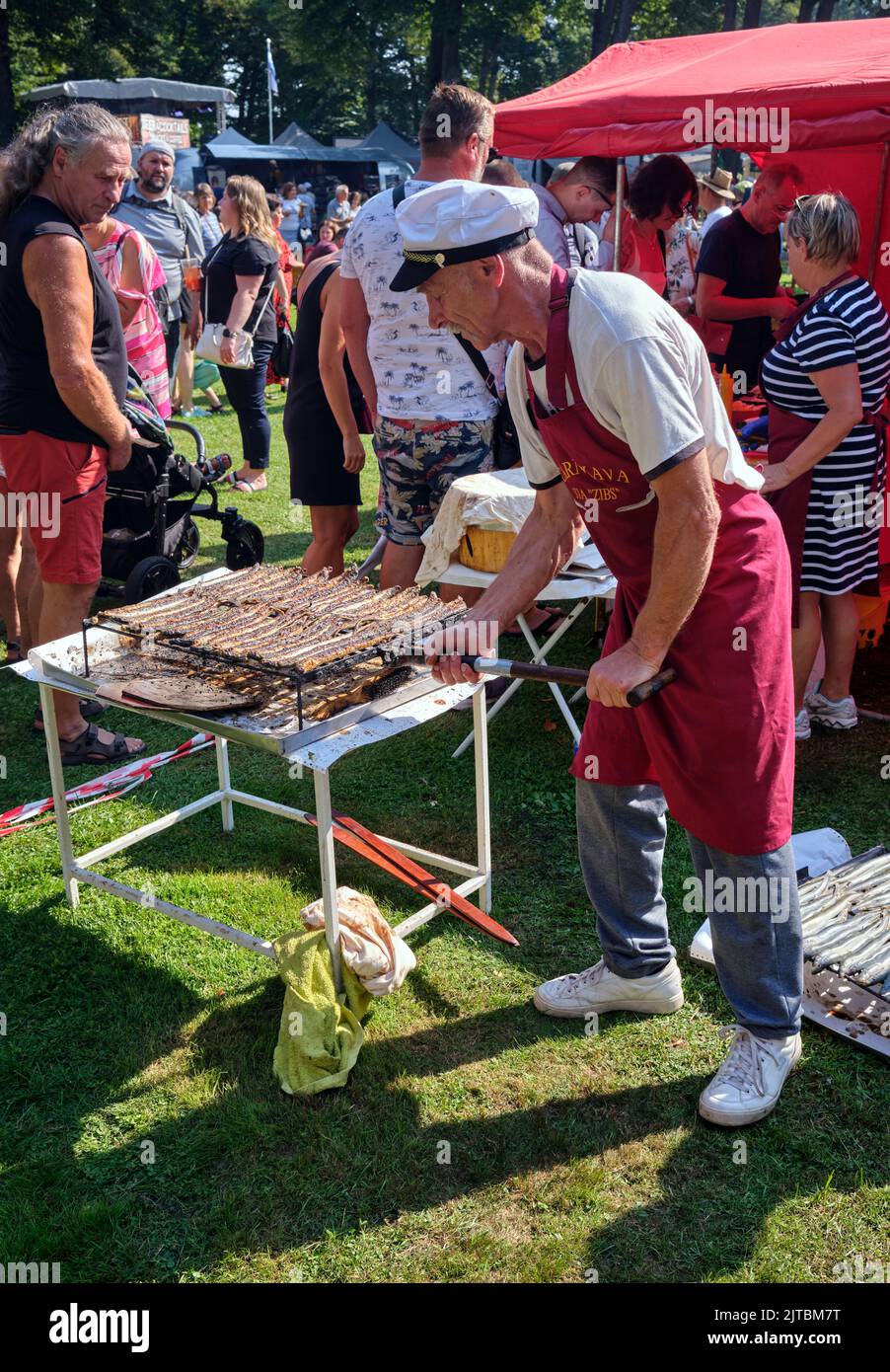 Carnikava City Festival- man preparing lampreys for baking,a delicacy ...