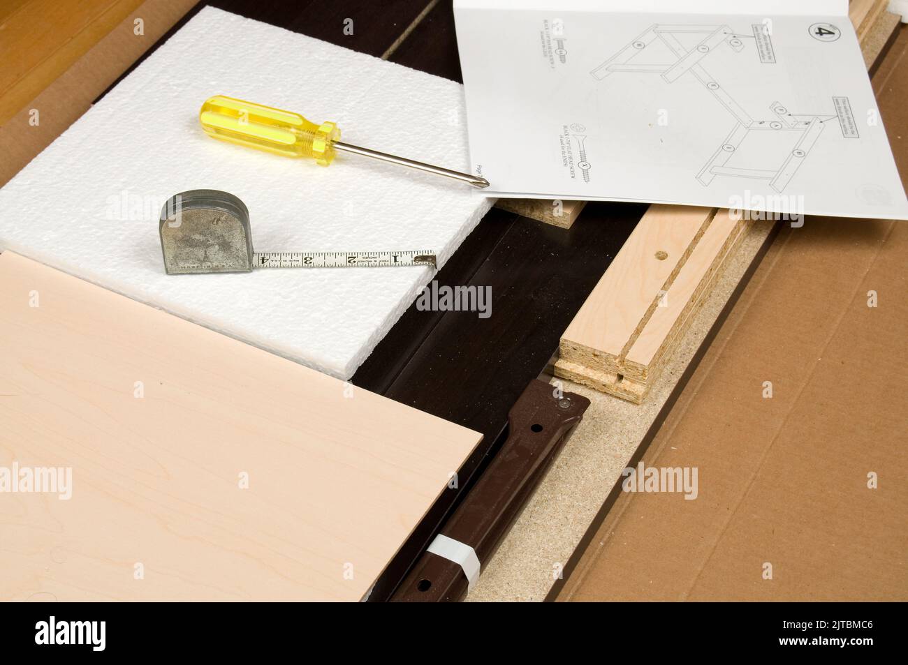 Assembling Furniture with a Measuring Tape and Screwdriver Horizontal ...