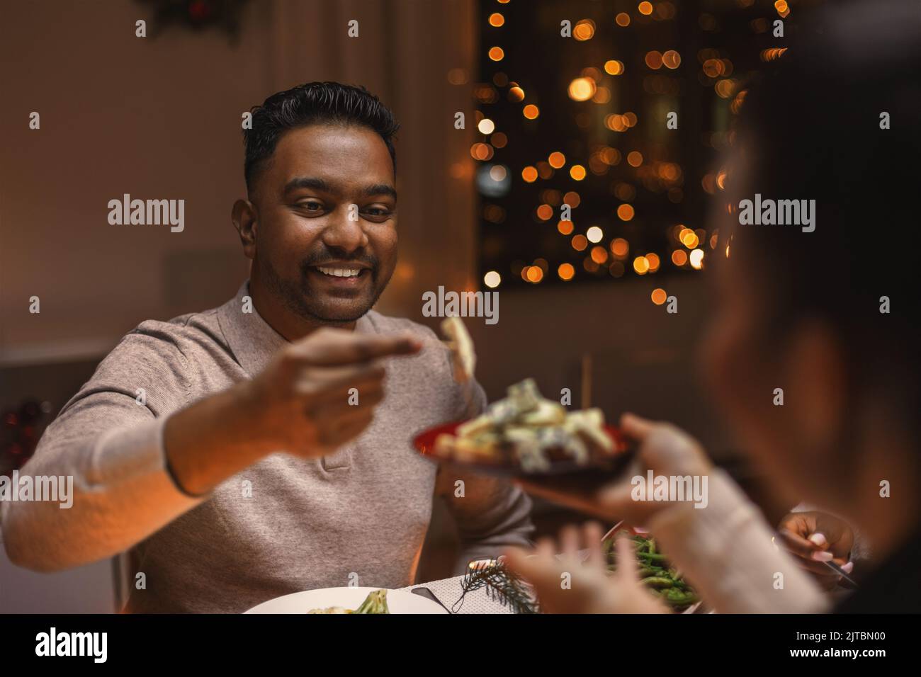 Indian family having dinner hi-res stock photography and images - Alamy