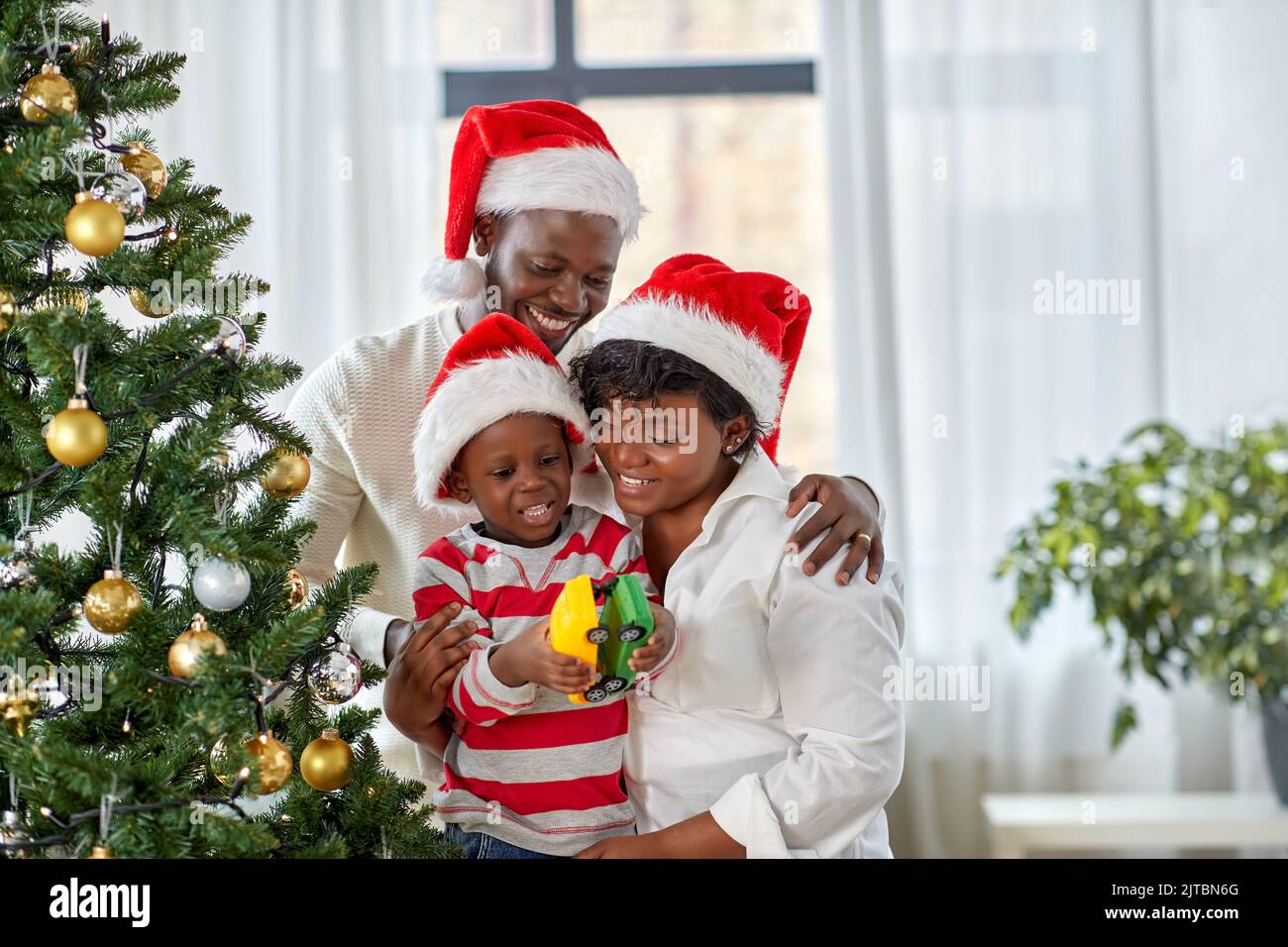 african family with toy cars at home on christmas Stock Photo - Alamy