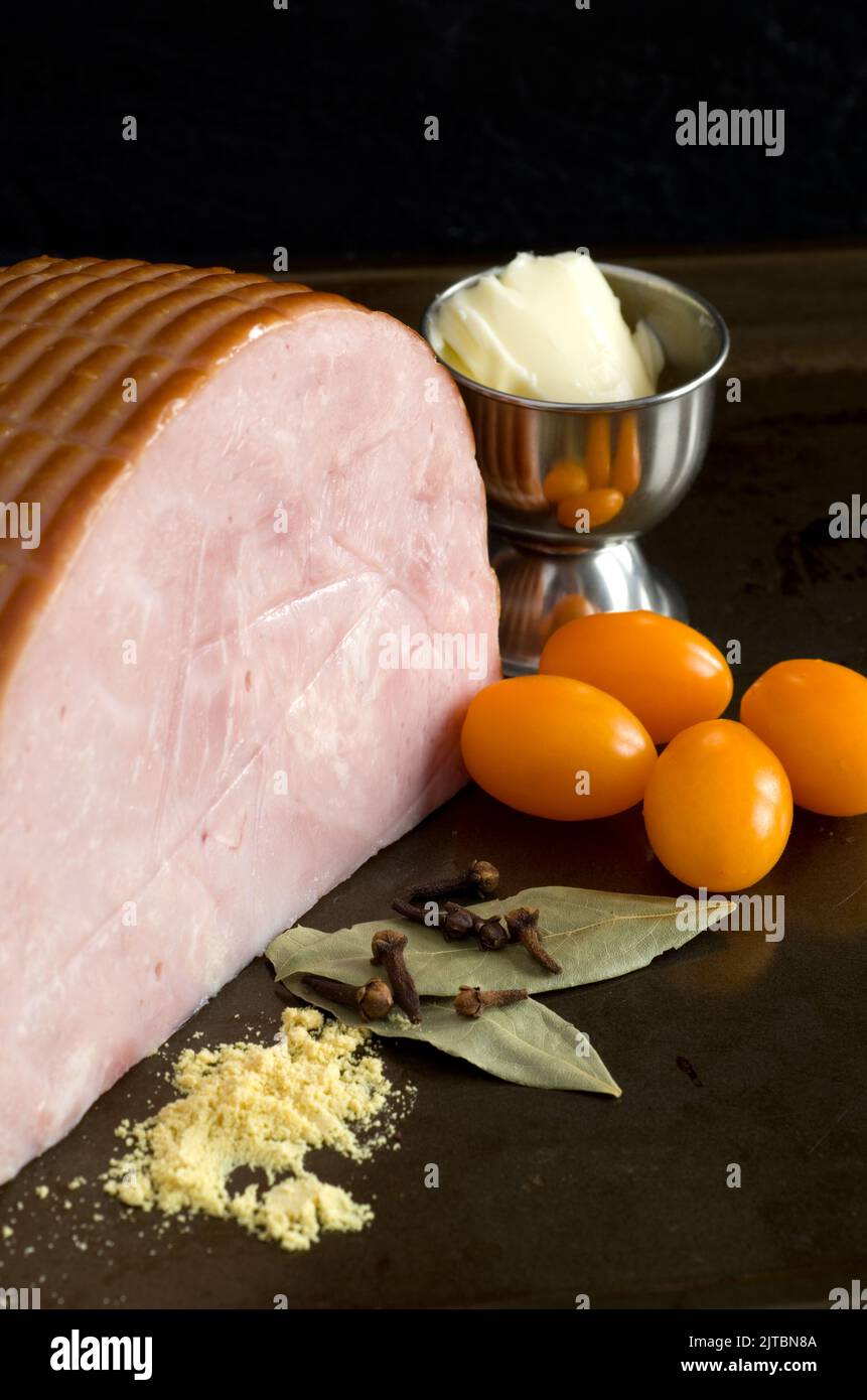 Delicious Ham with Tomatoes,Clove and Bay Leaves Vertical Stock Photo ...