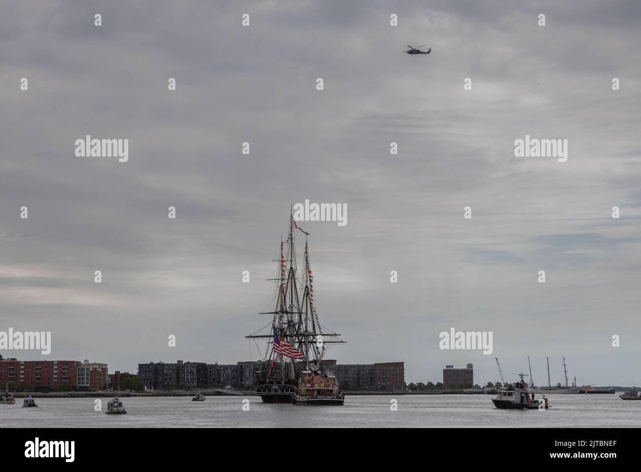 The oldest navy vessel USS Constitution moving through Boston harbor ...