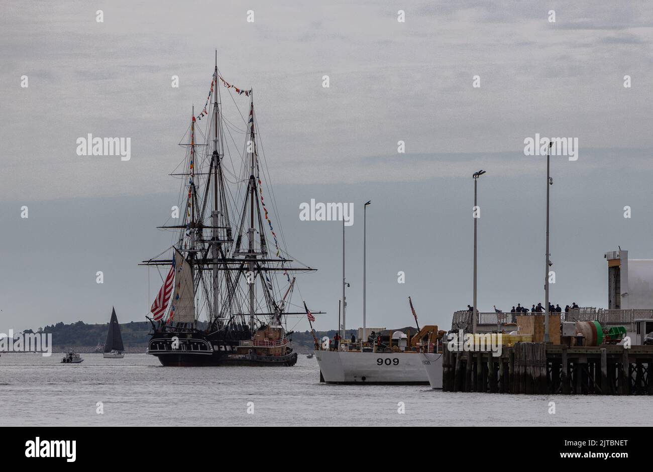 The oldest navy vessel USS Constitution moving through Boston harbor ...
