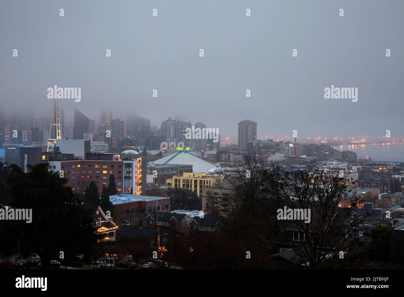 WA21896-00...WASHINGTON - Downtown Seattle covered in a dense fog ...