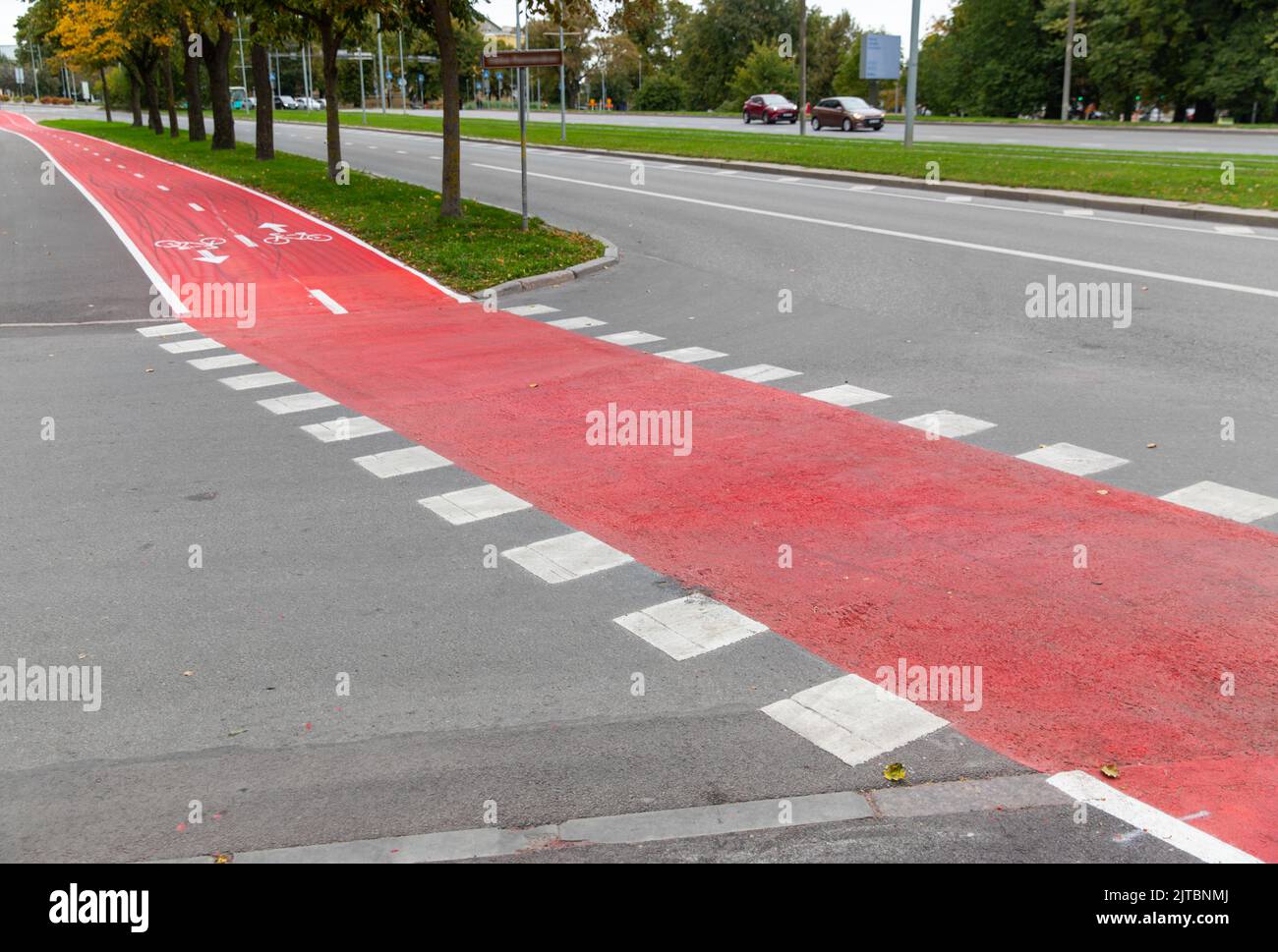 bike lane or red road with signs only for bicycles Stock Photo - Alamy