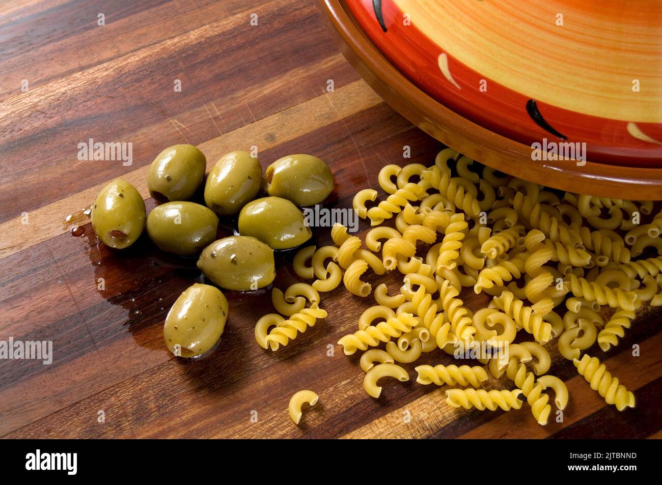Green Olives, Pastas and Red Tajine on Wood Counter Horizontal Stock ...