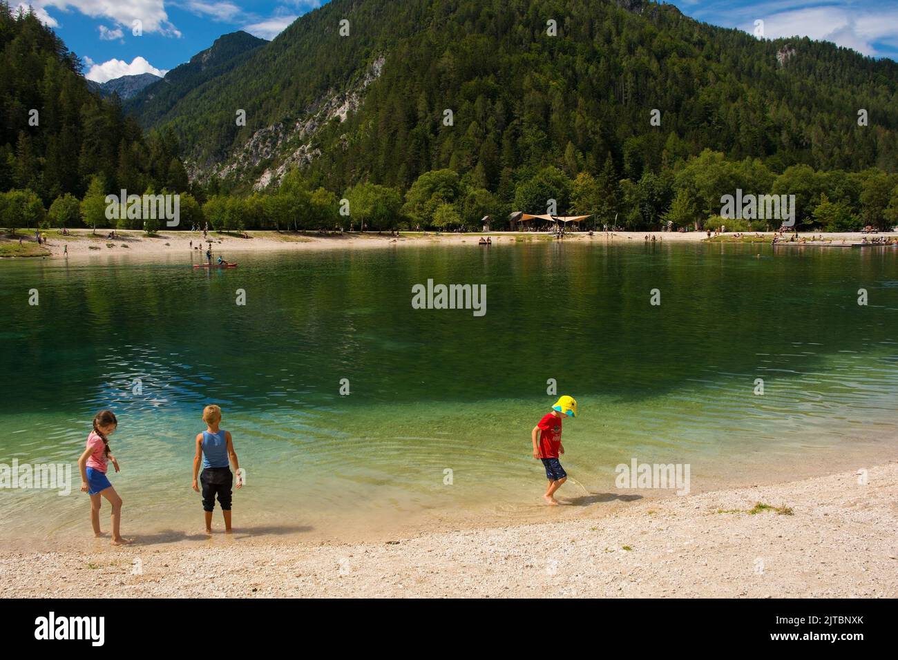 Kranjska Gora, Slovenia - August 21st 2022. Children play in Jasna Lake ... Kranjska Gora, Slovenia - August 21st 2022. Children play in Jasna Lake ...