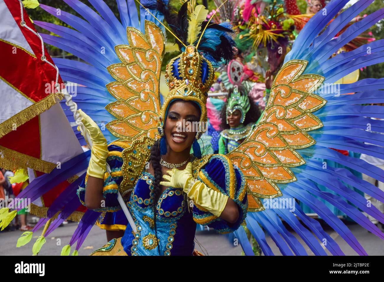 London, UK. 29th August 2022. A performer wears a flamboyant costume in ...