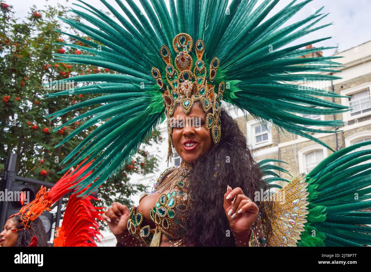 London, UK. 29th August 2022. A performer wears a flamboyant costume in ...
