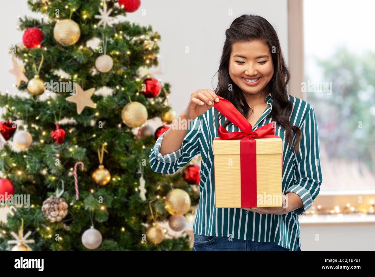 happy asian woman opening gift box Stock Photo - Alamy
