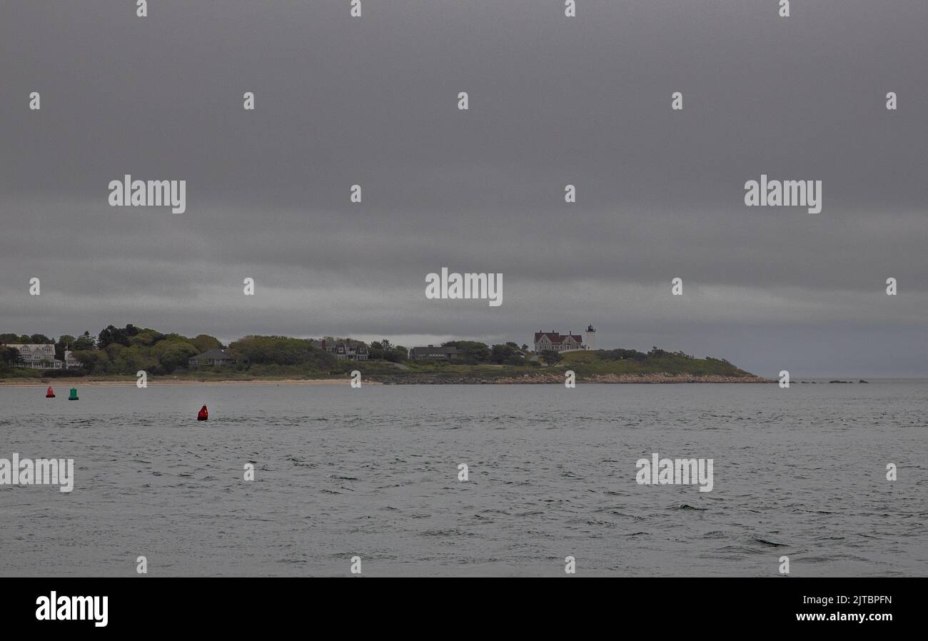 A view from the sea of coastline near the woods and Cape Cod in ...