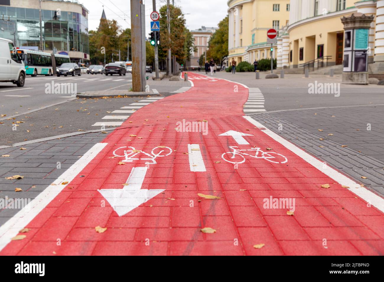 bike lane or red road with signs of bicycles Stock Photo - Alamy