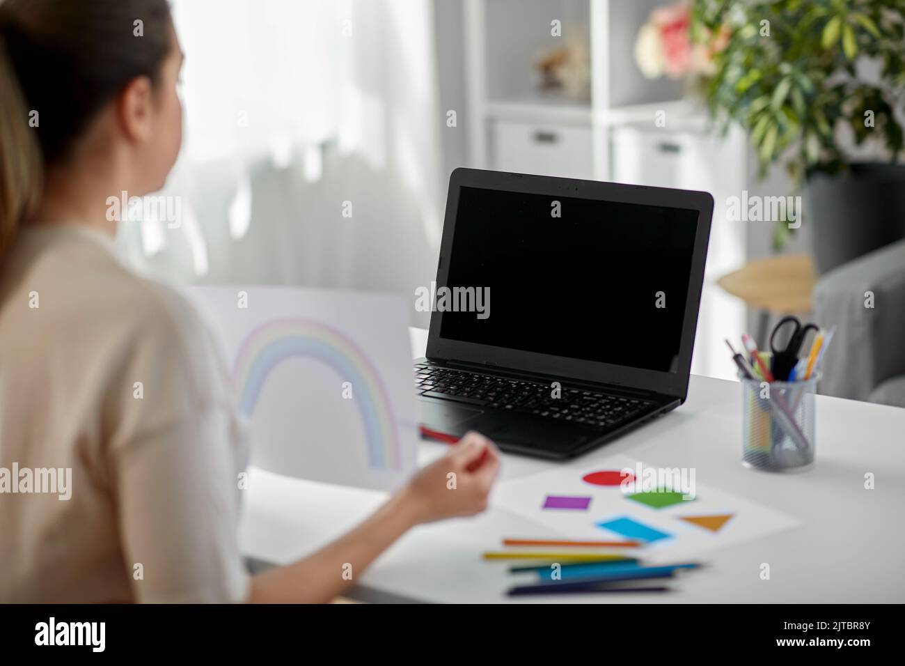 teacher having online class at home Stock Photo - Alamy