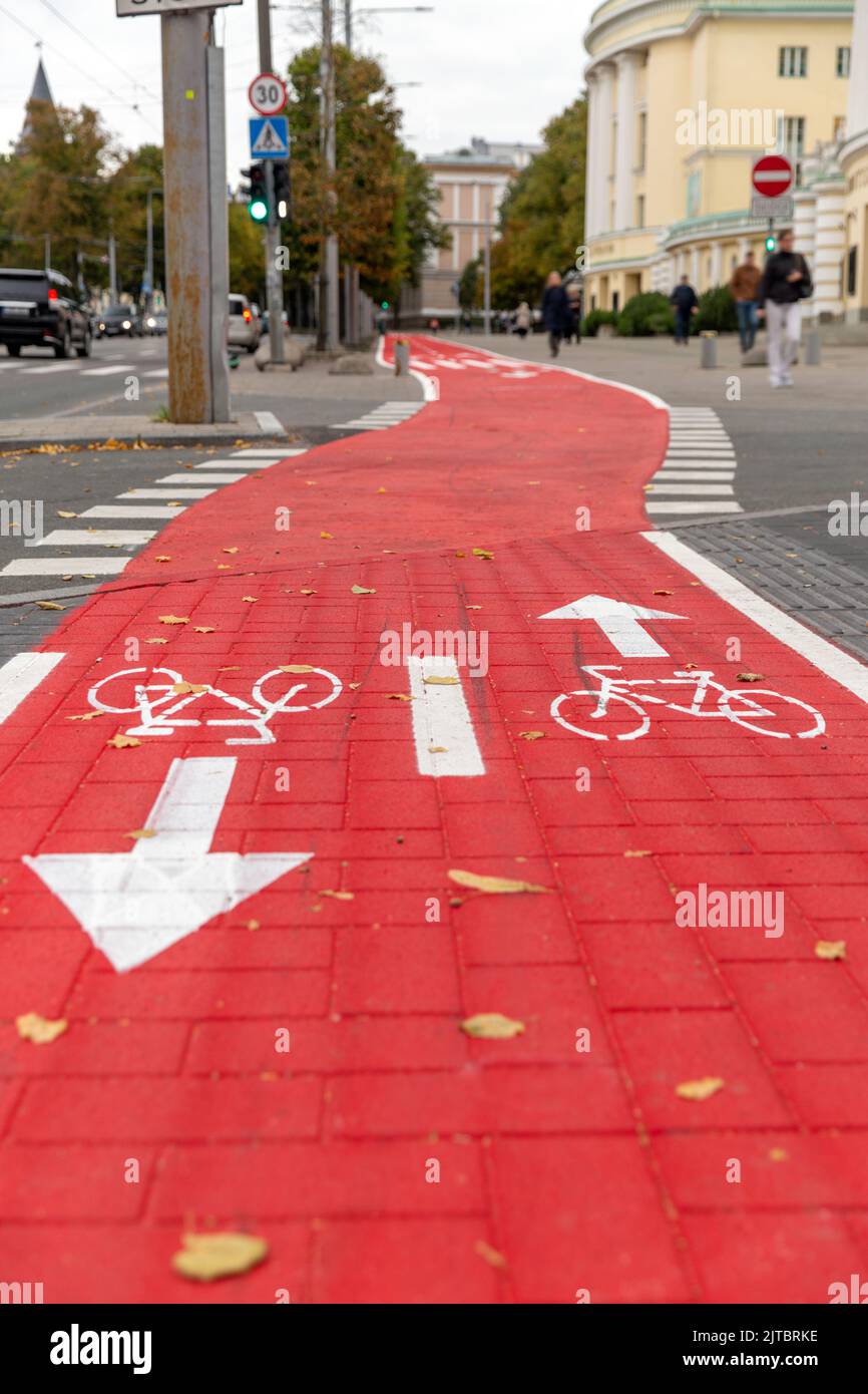 bike lane or red road with signs of bicycles Stock Photo - Alamy