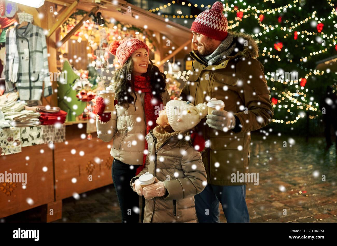 family with takeaway drinks at christmas market Stock Photo - Alamy
