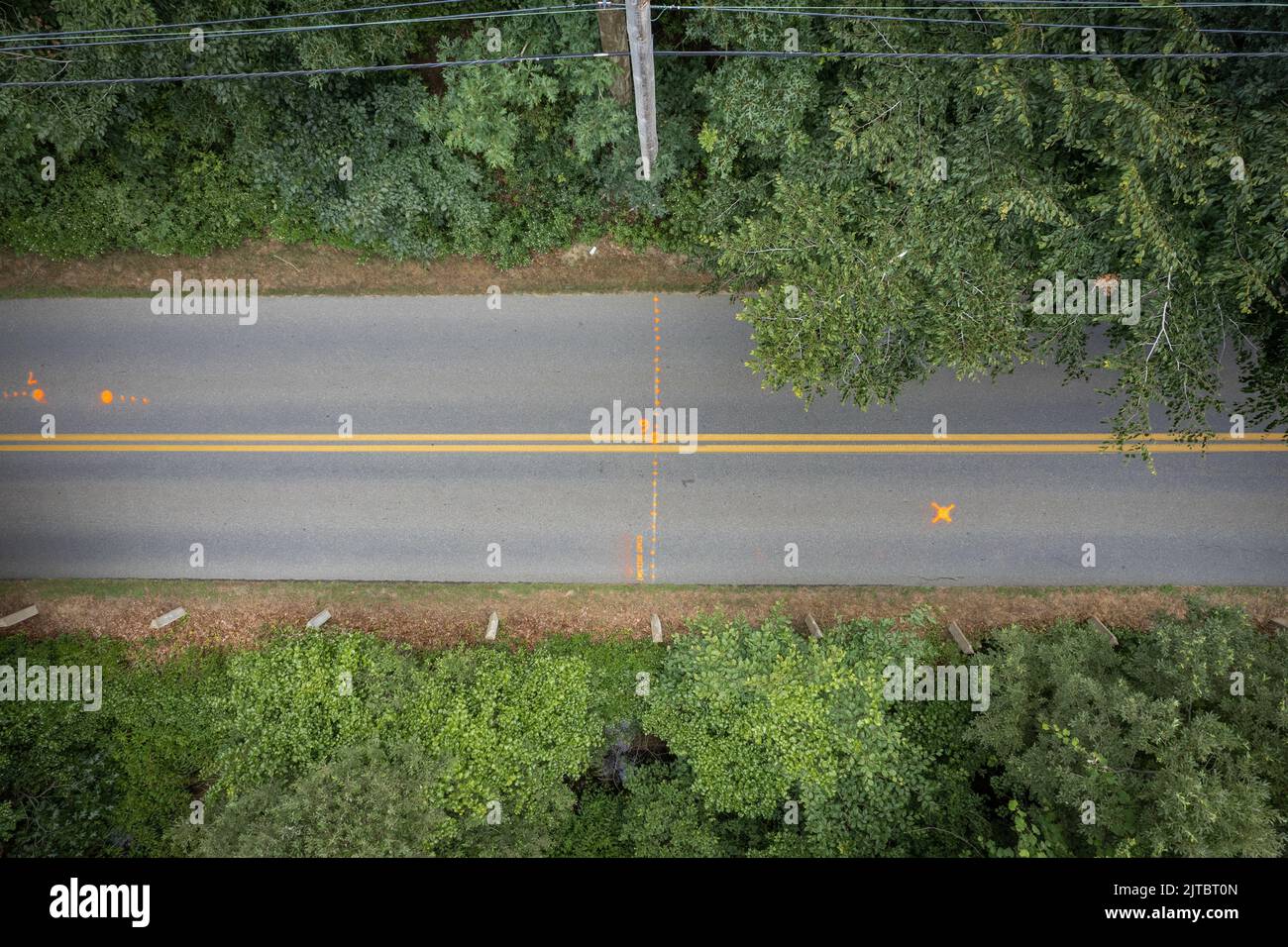 An aerial view of a roadway with spray painted markers ready for a road ...