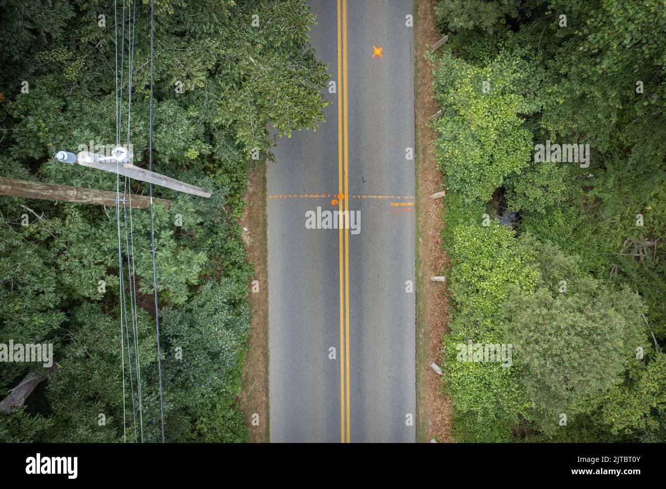 An aerial view of a roadway with spray painted markers ready for a road ...