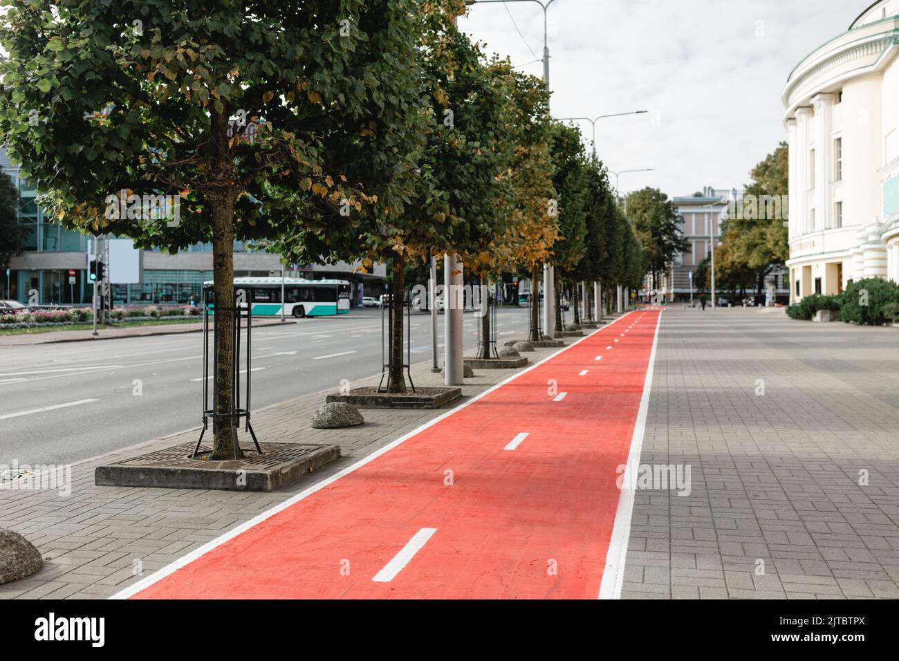 bike lane or red road for bicycles on city street Stock Photo - Alamy