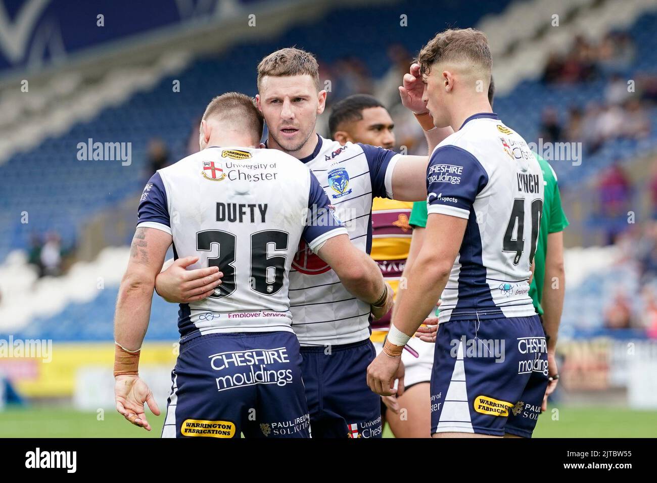 George Williams #7 of Warrington Wolves celebrates with Matt Dufty and ...
