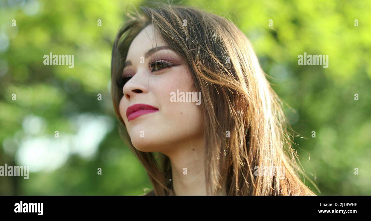 Happy young woman nodding yes with head in outdoor park. Pretty girl ...