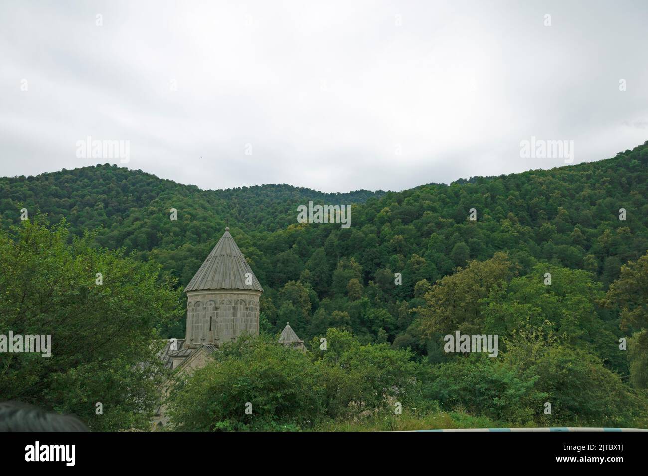 Haghartsin monastery complex surrounded by dense green forest, in a ...