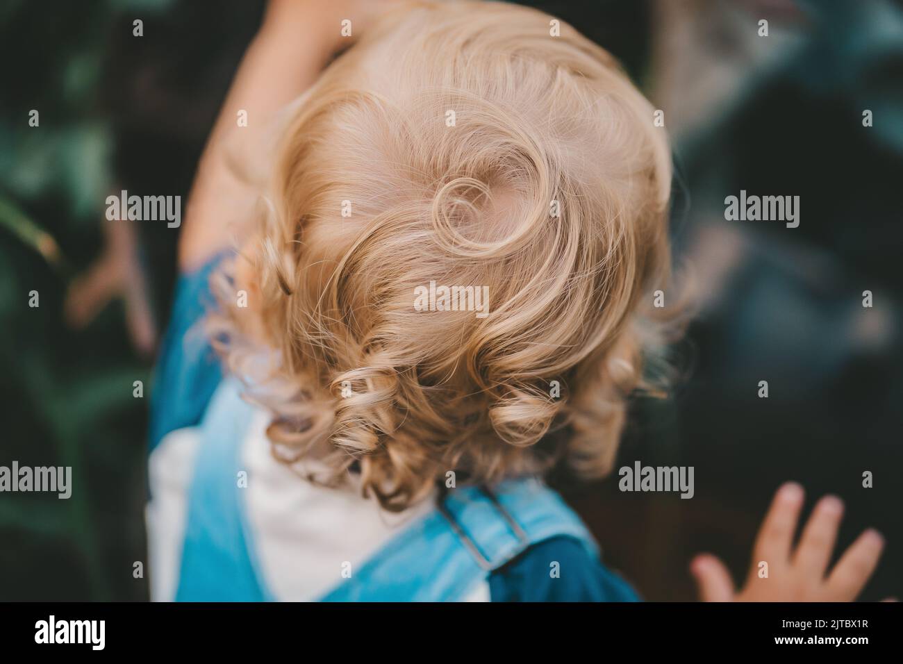 Woman holding baby girl from behind hi-res stock photography and images ...